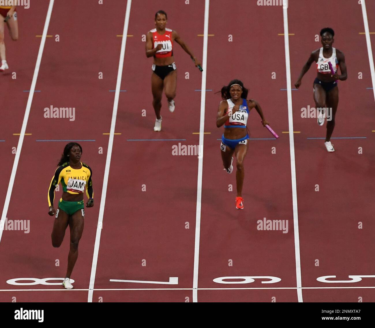 Jamaica's team WILLIAMS Briana ( L, 8 lane) crosses the finish line during the Women's ' 4 x100 ...