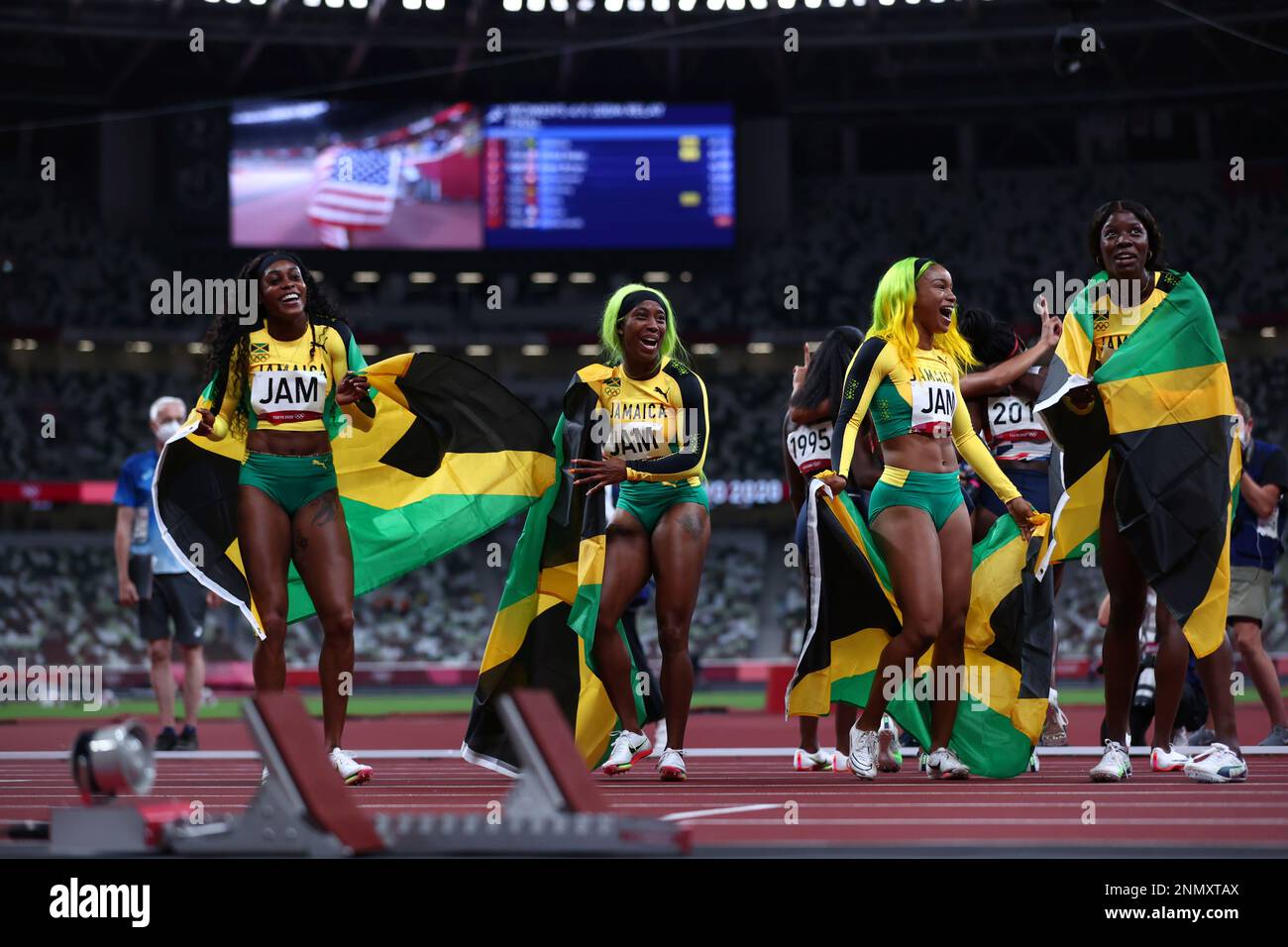Jamaica's team memebers pose after capturing the gold medal of the Women's ' 4 x100 Relay Final ...