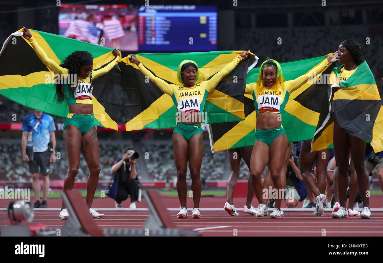 Jamaica's team memebers pose after capturing the gold medal of the Women's ' 4 x100 Relay Final ...