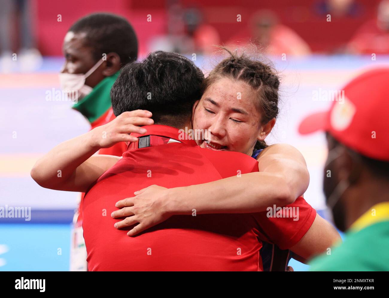 Mongolia's BAT OCHIR Bolortuya (L, blue) and Cameroon's ESSOMBE TIAKO ...