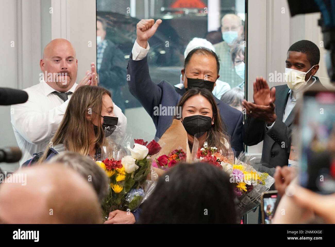 Minnesota gymnasts Grace McCallum,left, and Suni Lee are greeted by ...