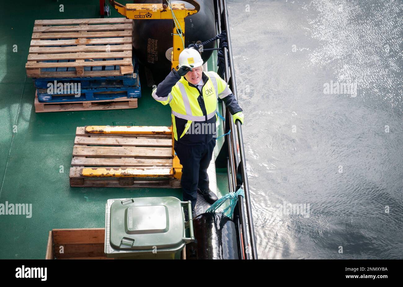 Britain's Prime Minister Boris Johnson poses for a photo, onboard the ...