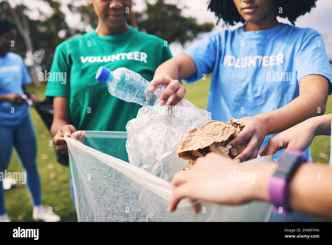 Recycle, plastic bag and ngo volunteer group cleaning outdoor park for ...