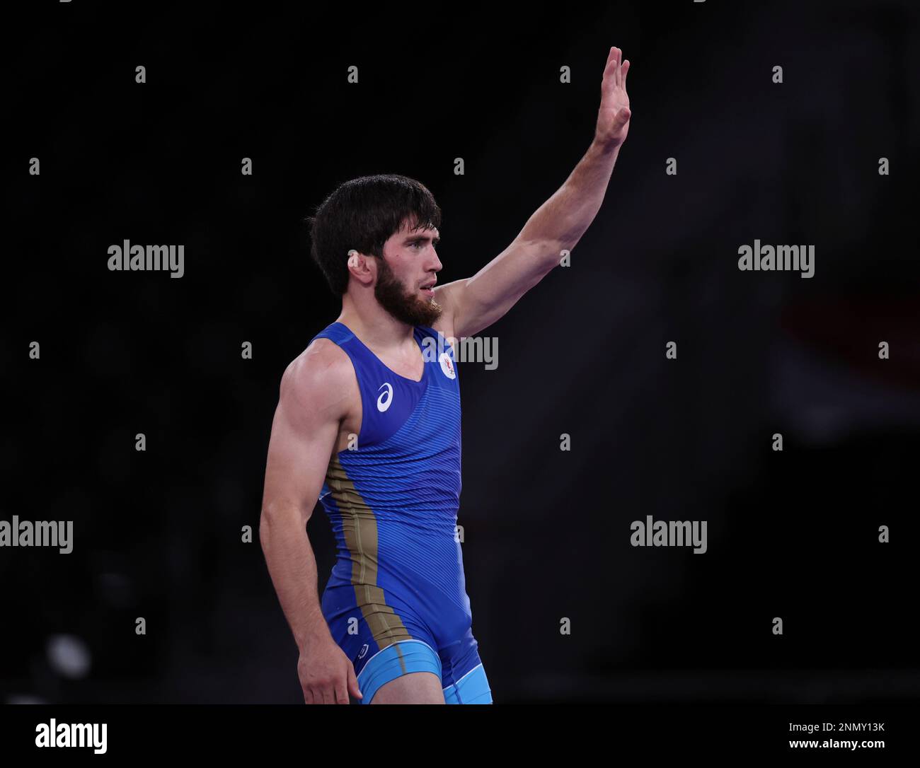 ROC's UGUEV Zavur celebrates after winning the Wrestling Men's ...