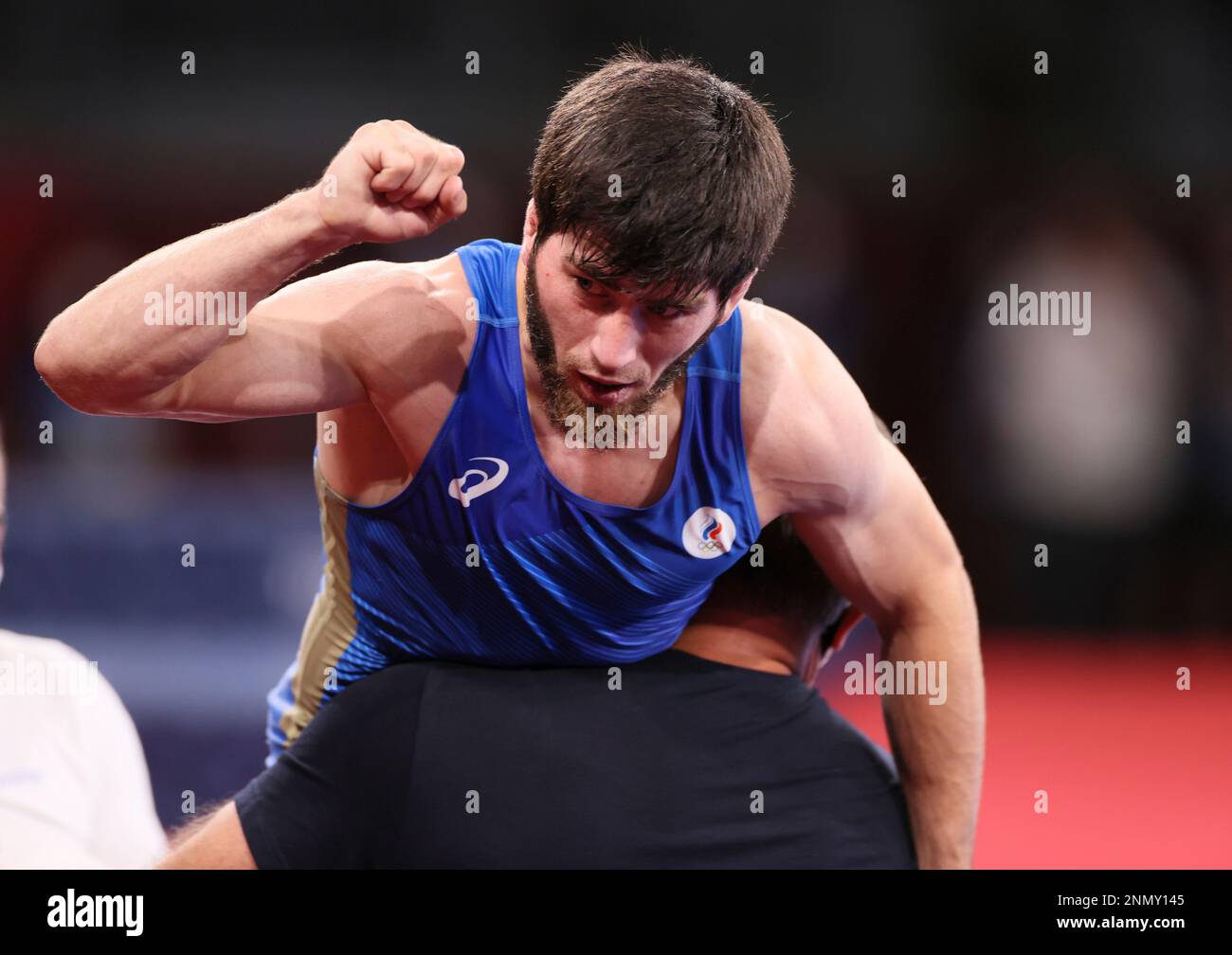 ROC's UGUEV Zavur celebrates after winning the Wrestling Men's ...