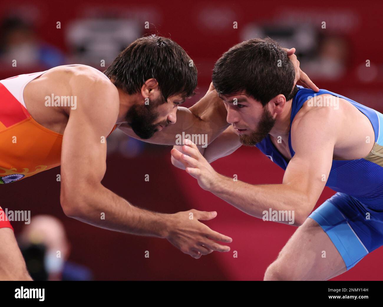 India's RAVI Kumar (red) and ROC's UGUEV Zavur compete during Wrestling ...
