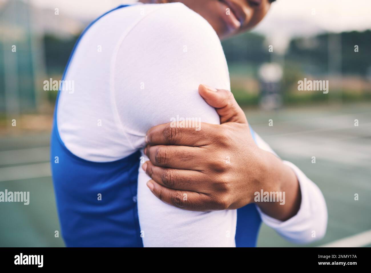 Arm injury, sport pain and netball athlete on a outdoor sports court ...