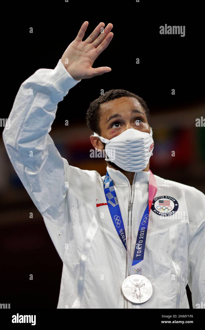 Duke Ragan, of the United States, wears his silver medal for feather ...