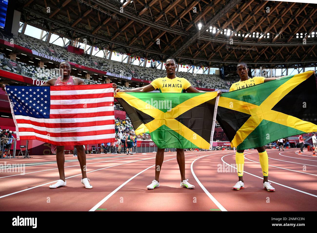 Hansle Parchment, of Jamaica, center, the gold medal winner in the men ...