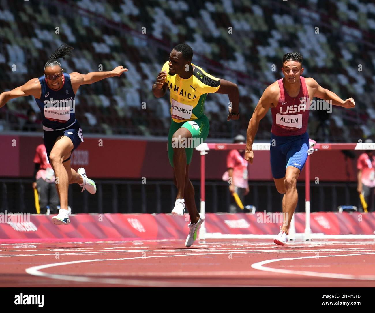 PARCHMENT Hansle (C, 7) of Jamaica crosses the finish line during the ...