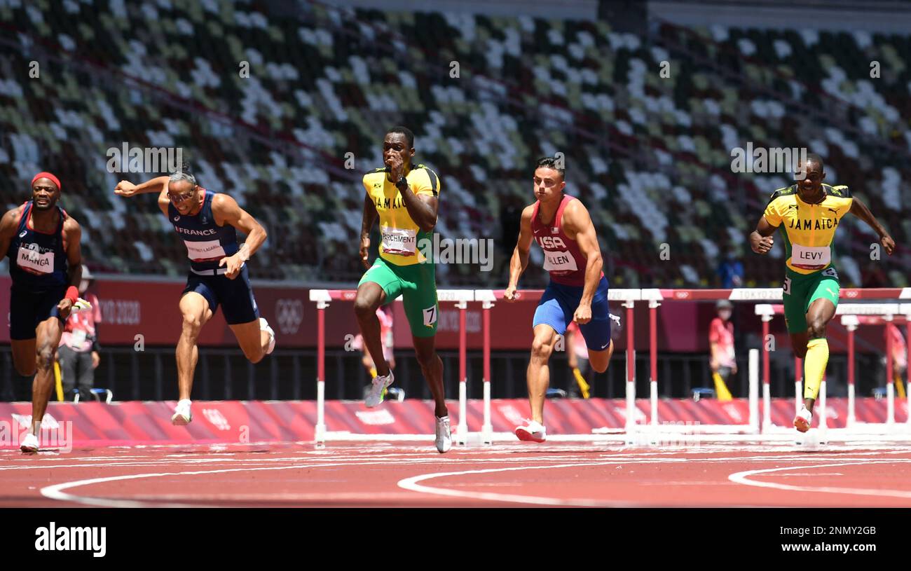 PARCHMENT Hansle (C, 7) of Jamaica crosses the finish line during the ...