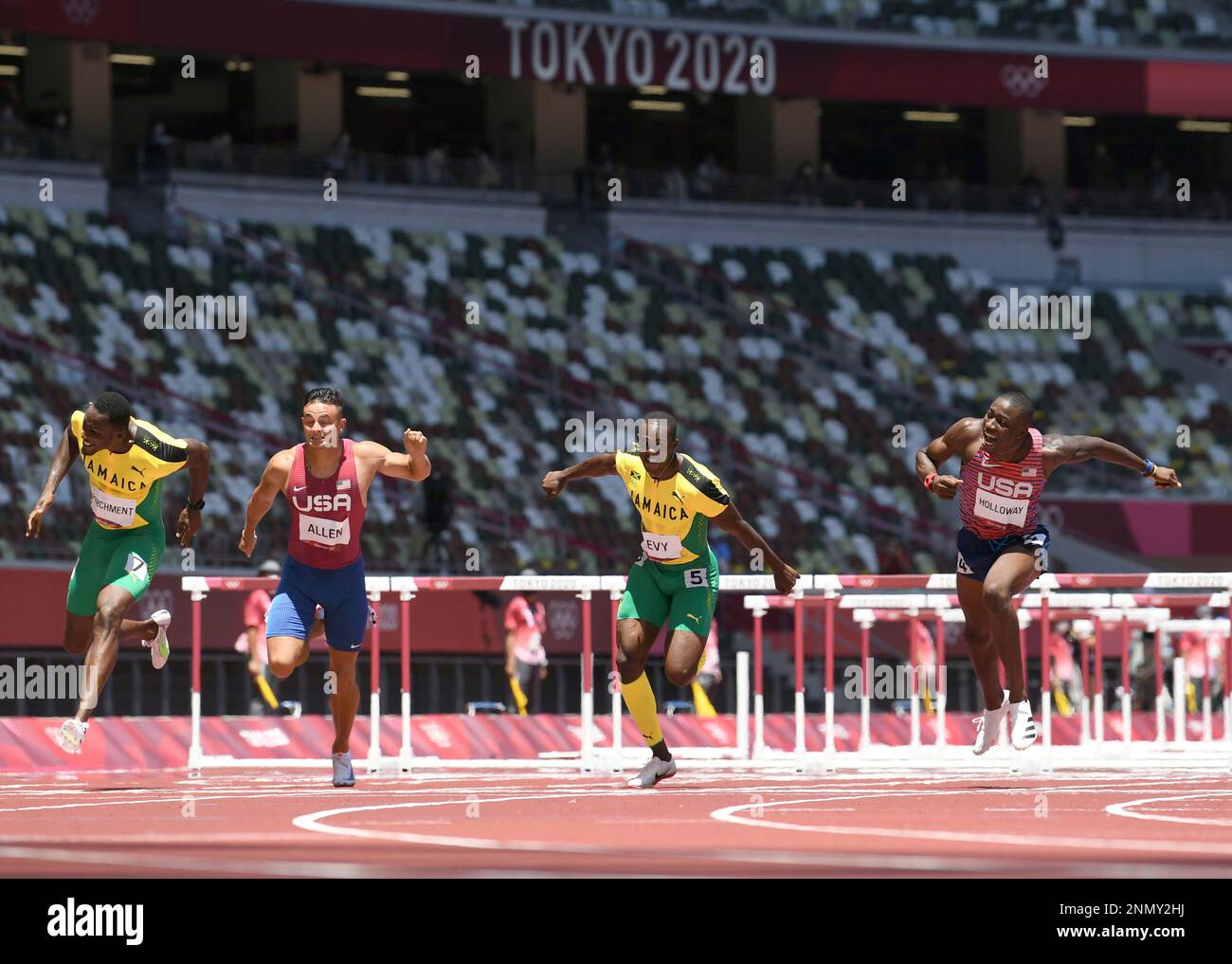 PARCHMENT Hansle ( L, 7) of Jamaica crosses the finish line during the ...