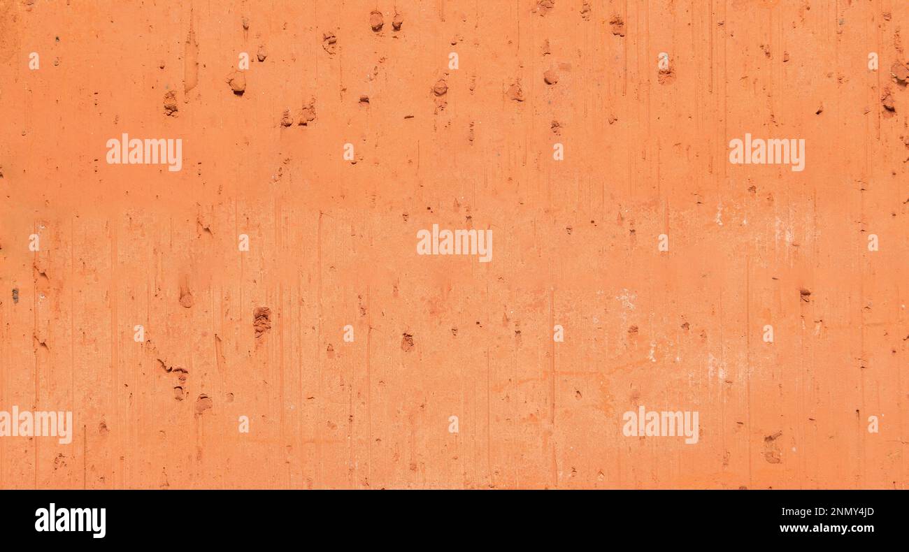 Abstract background of a longitudinal section of orange clay bricks ...