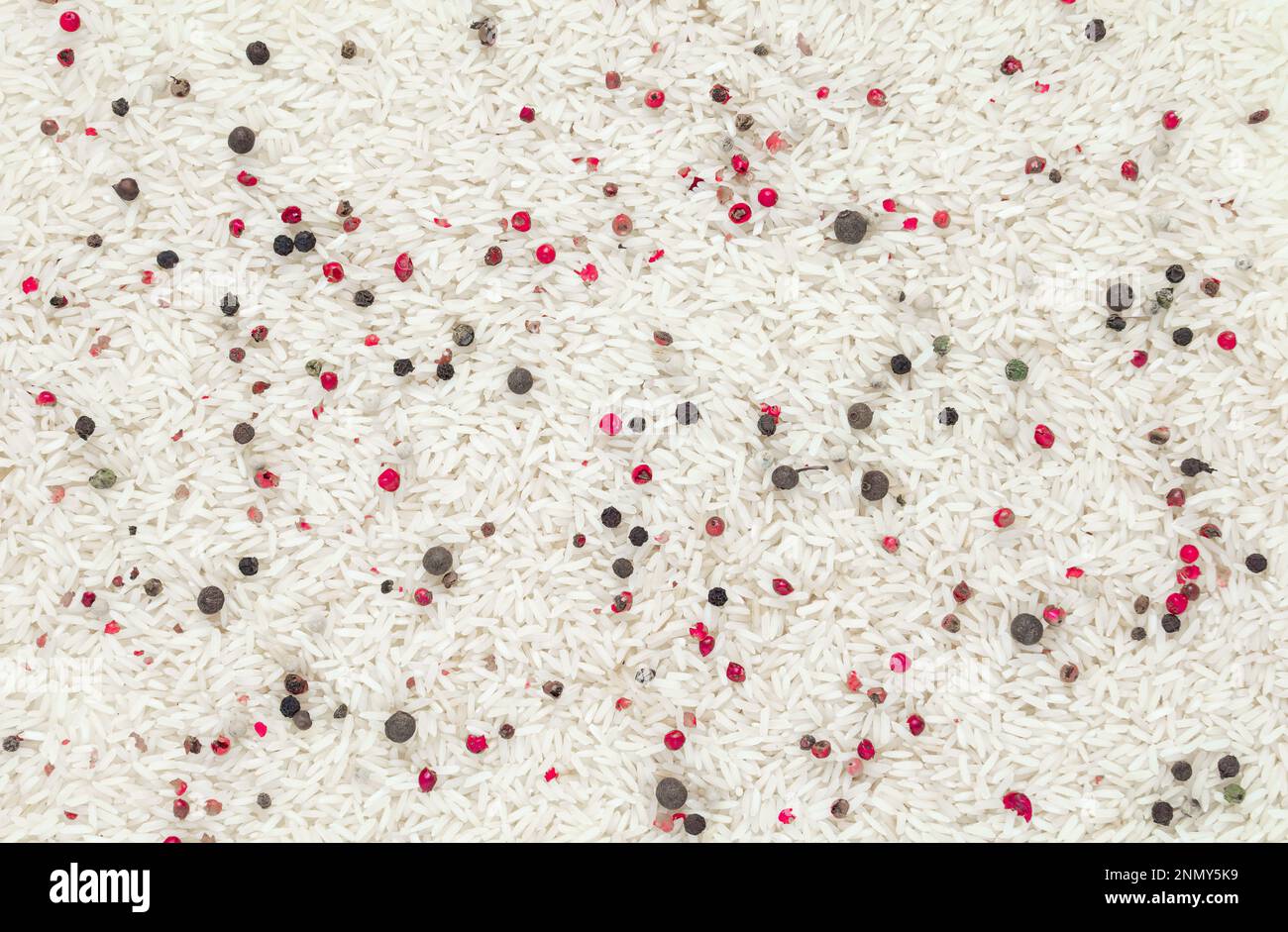 Food background. Rice with the addition of multi-colored peppers with ...