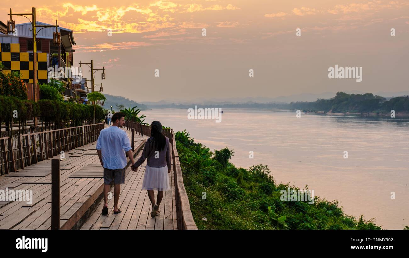 A couple of men and women visit Chiang Khan village North Eastern ...