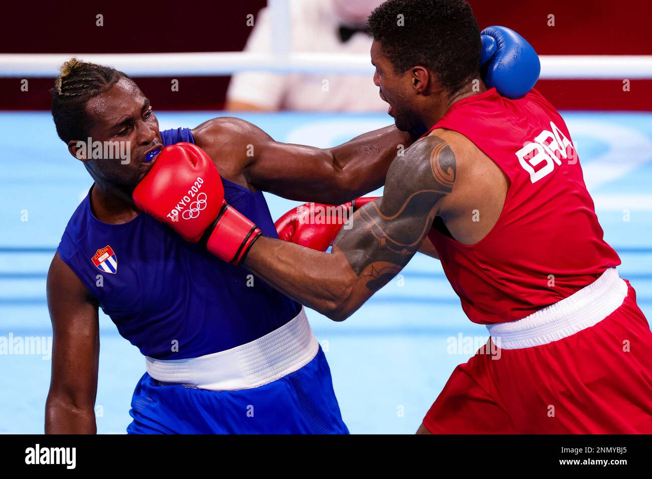 TOKYO, JAPAN - AUGUST 03: Abner Teixeira of Team Brazil and Julio La Cruz of Team Cuba in action ...