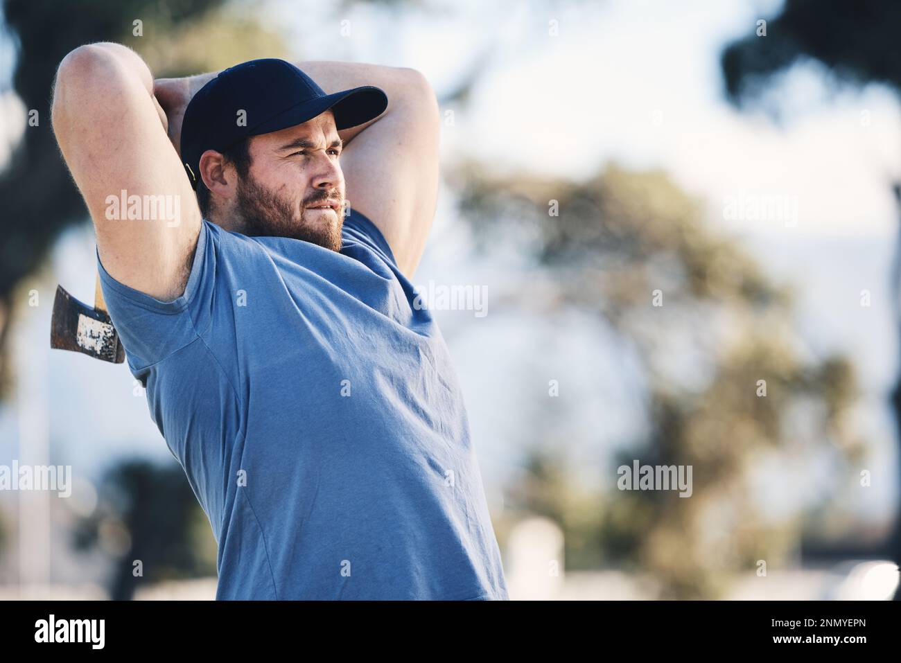 Sports, training and man throw axe on range for adventure, exercise and ...