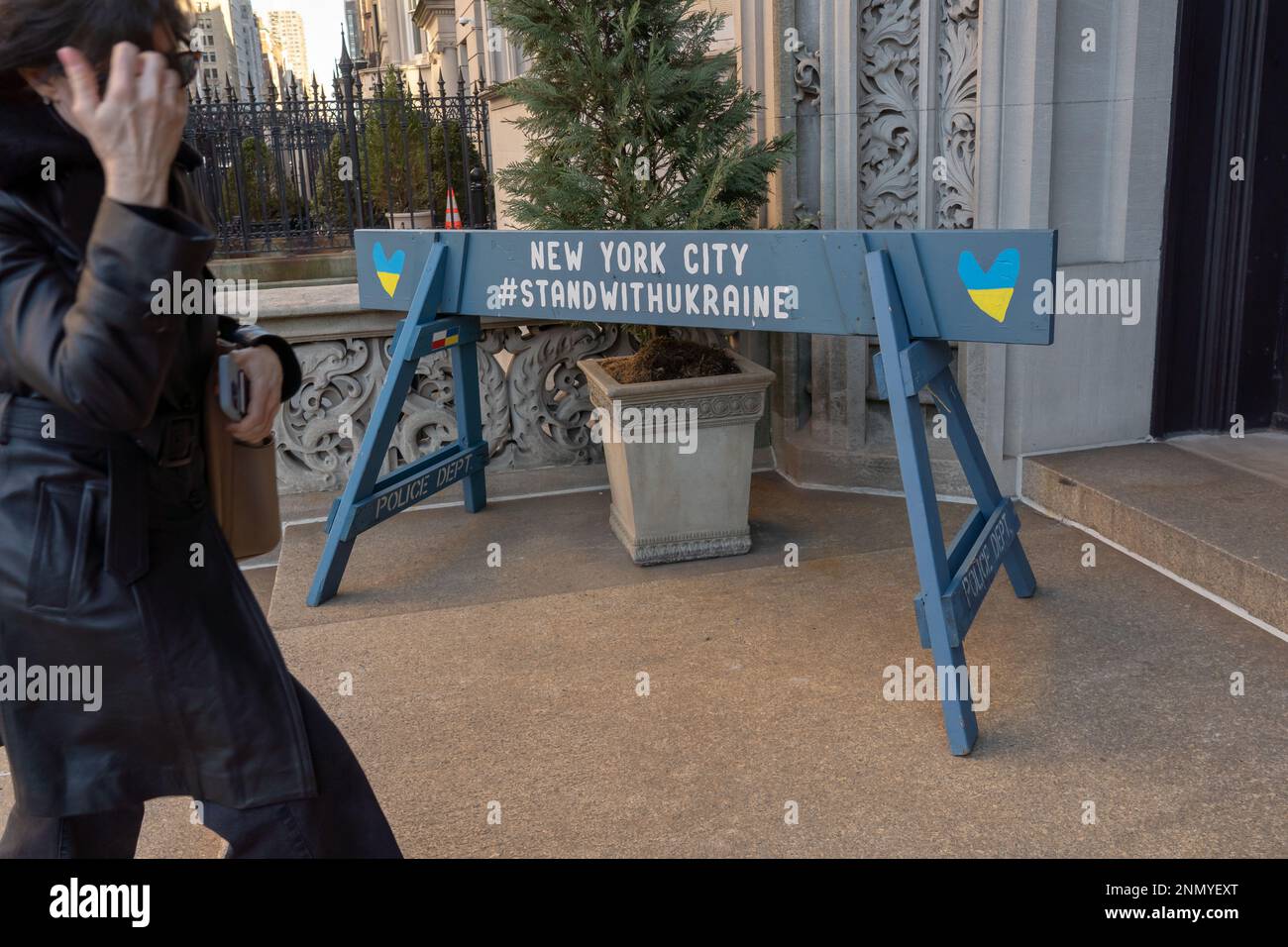 NEW YORK, NEW YORK - FEBRUARY 24: A women walks past a NYPD Barricade with New York City # ...