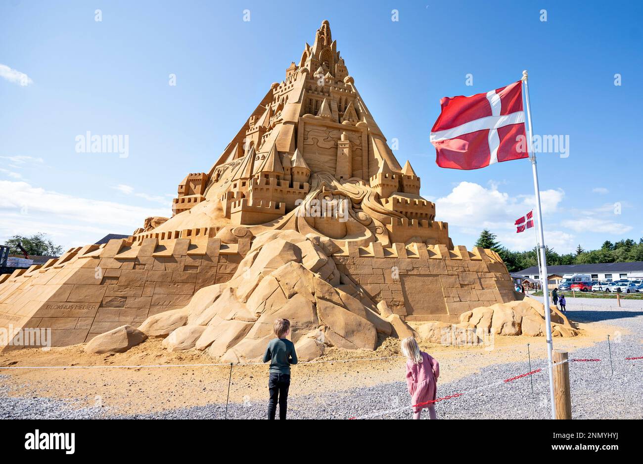 The world's largest sand castle is seen in the parking lot at ...