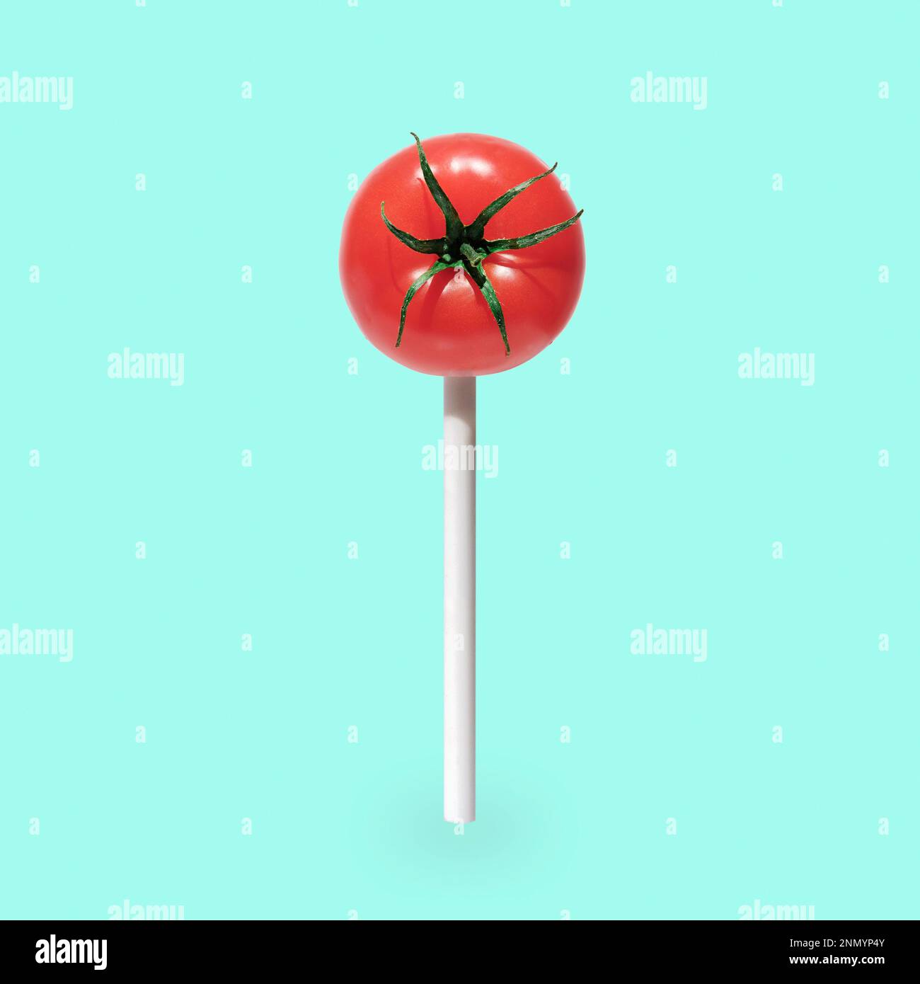 Fun candy tomato on a stick. Minimal pop art concept of healthy eating ...