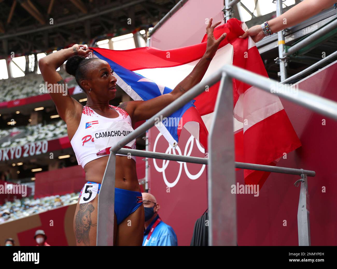 Puerto Rico's CAMACHO-QUINN Jasmine receives the national flag after ...