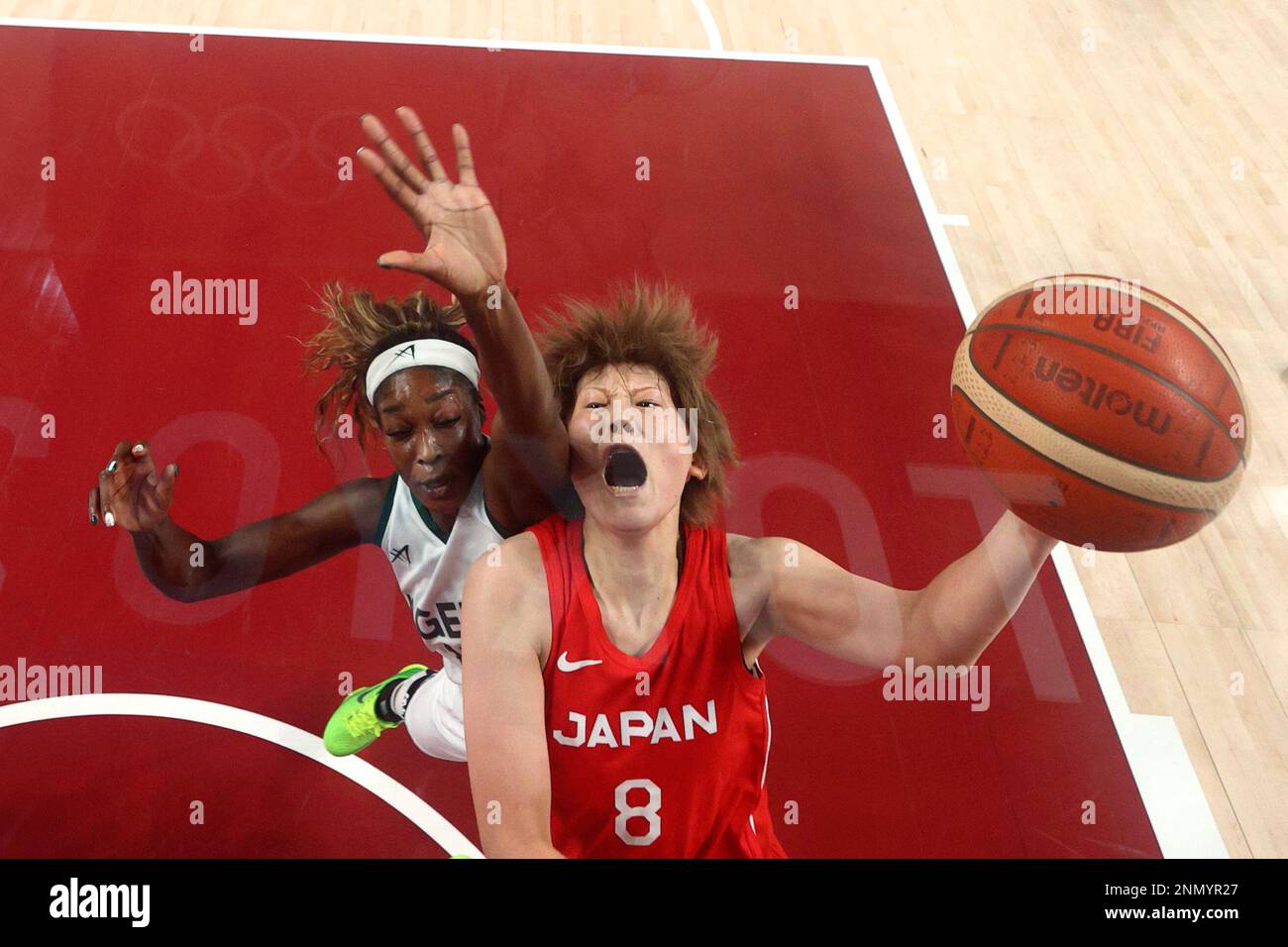 Japan's Maki Takada (8) drives past Nigeria's Victoria Macaulay (25) to ...