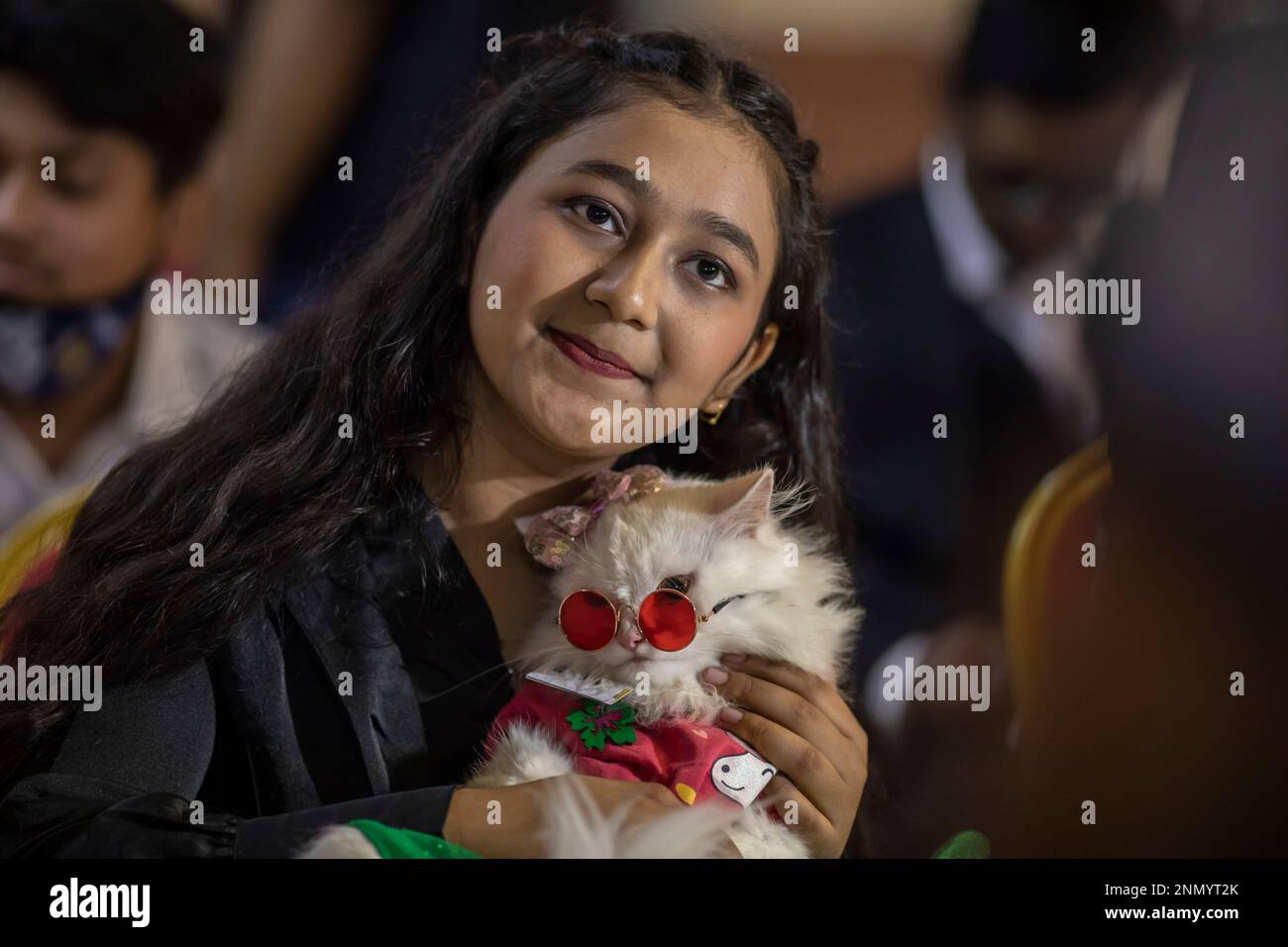 Dhaka, Bangladesh. 24th Feb, 2023. A cat owner shows off her pet cat ...