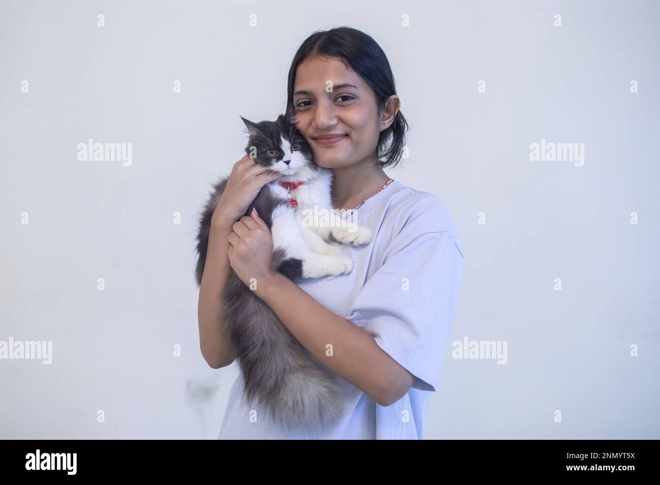 Dhaka, Bangladesh. 24th Feb, 2023. A cat owner shows off her pet cat ...