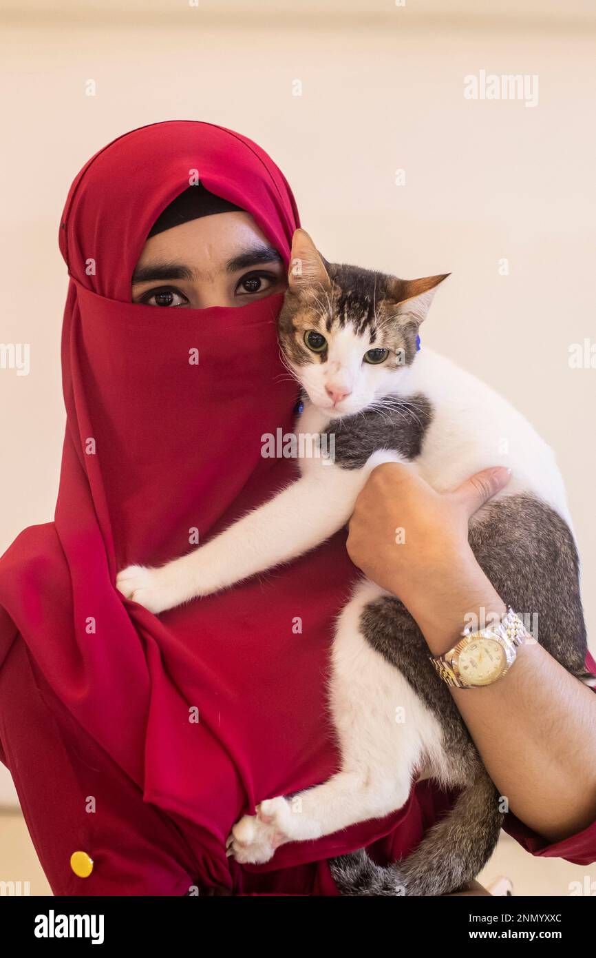 Dhaka, Bangladesh. 24th Feb, 2023. A cat owner shows off her pet cat ...