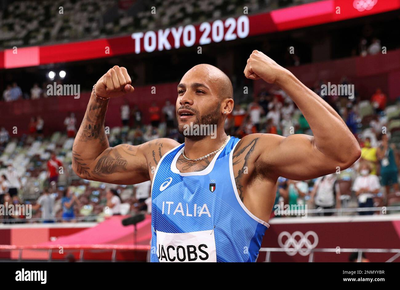 Lamont Marcell Jacobs of Italy celebrates after winning the final of ...