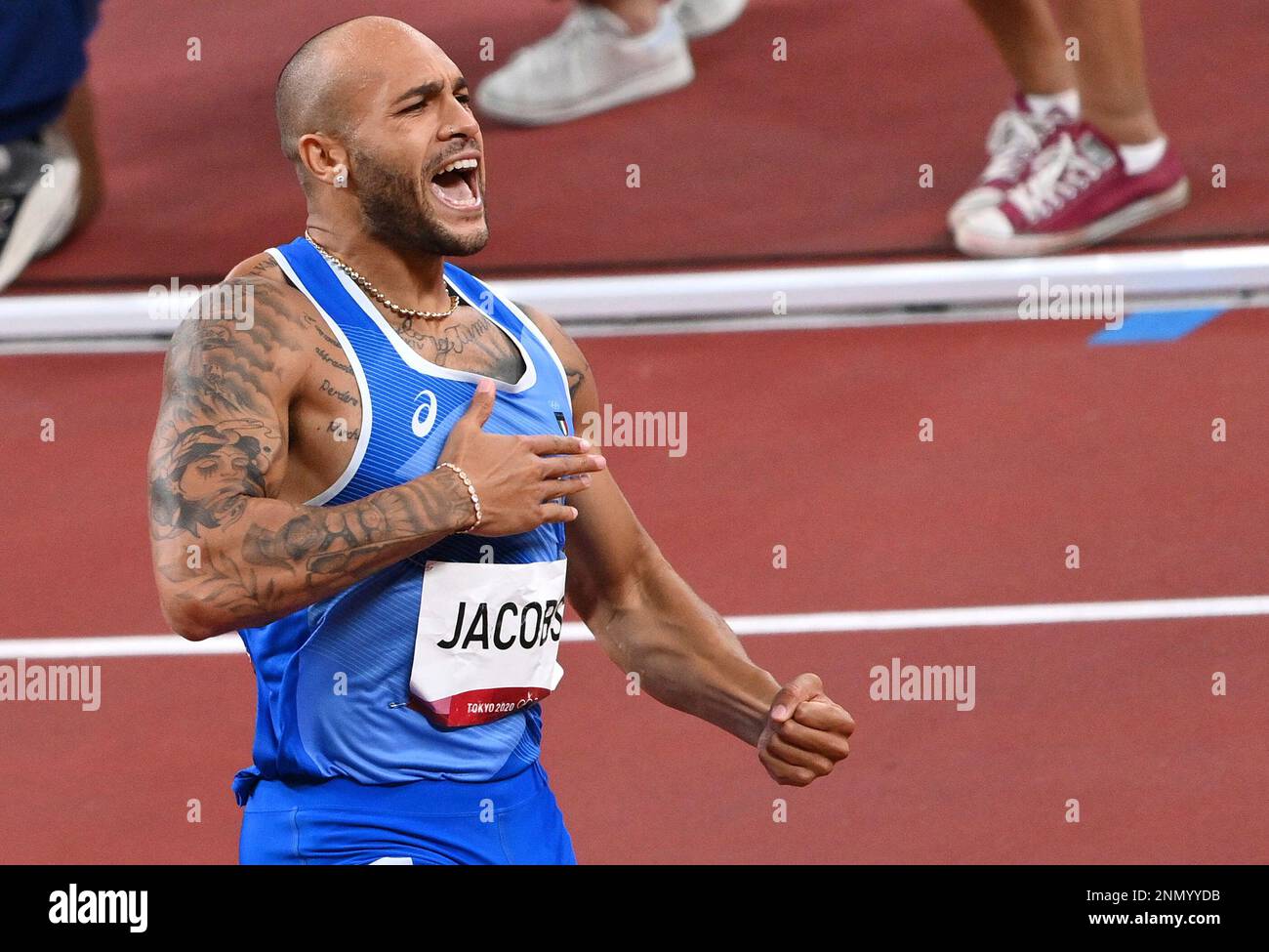 Lamont Marcell Jacobs, of Italy, celebrates after winning the final of ...