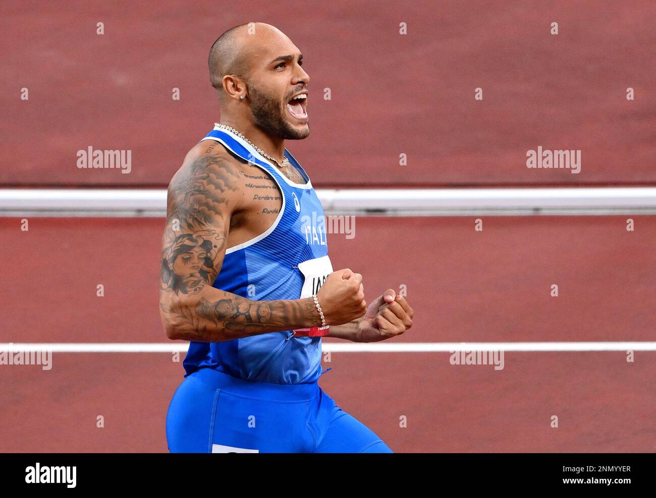 Lamont Marcell Jacobs, of Italy, celebrates after winning the final of ...