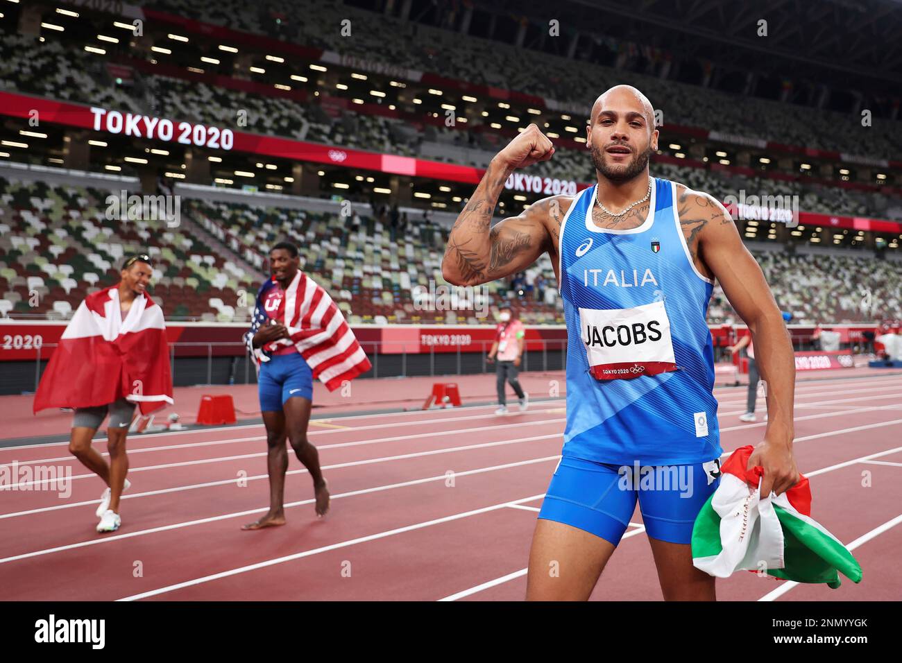 Lamont Marcell Jacobs, of Italy, celebrates after winning the final of ...