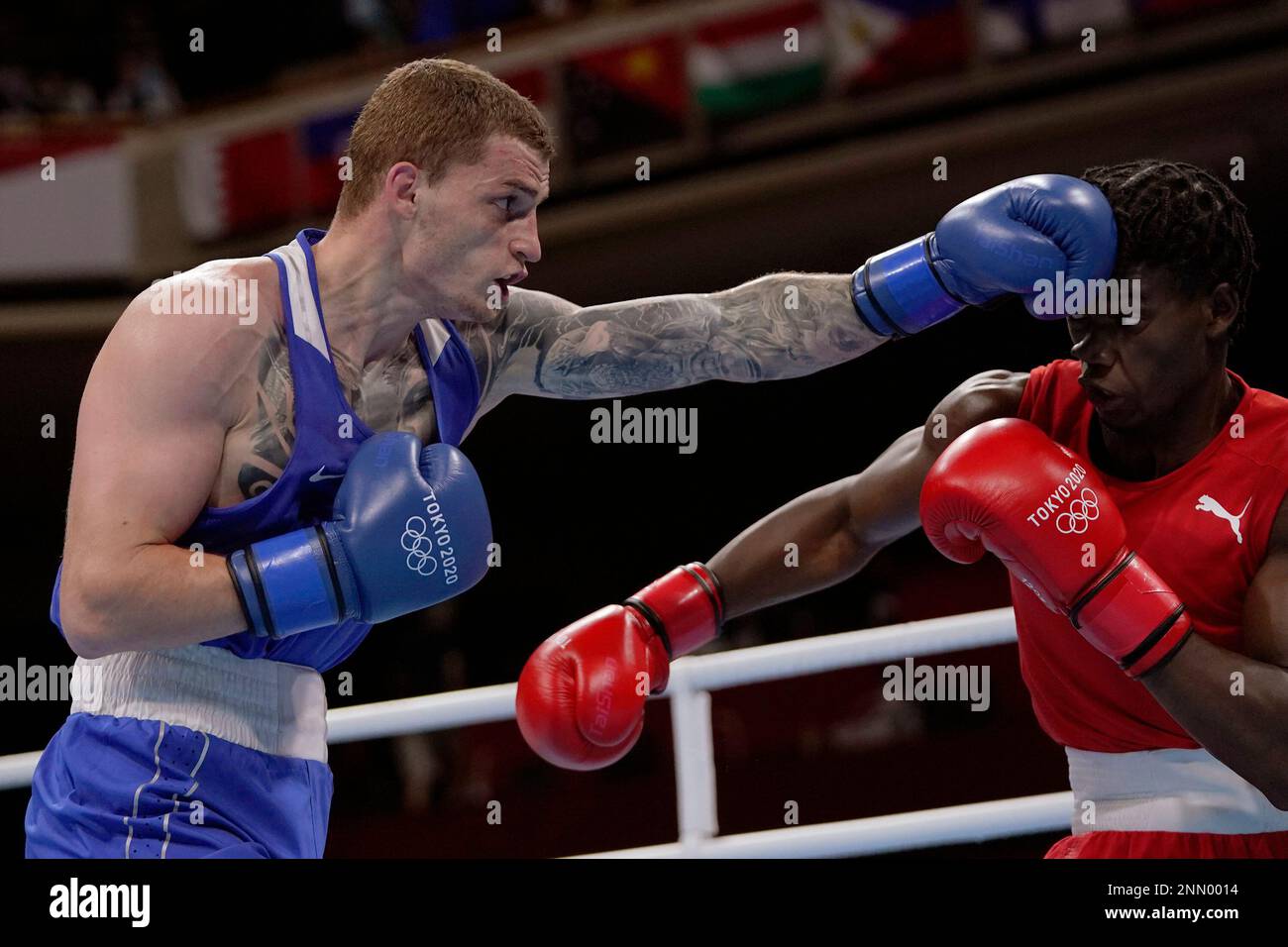 Haiti's Darrelle Valsaint Jr., is punched by Gleb Bakshi, of the Russian Olympic Committee ...
