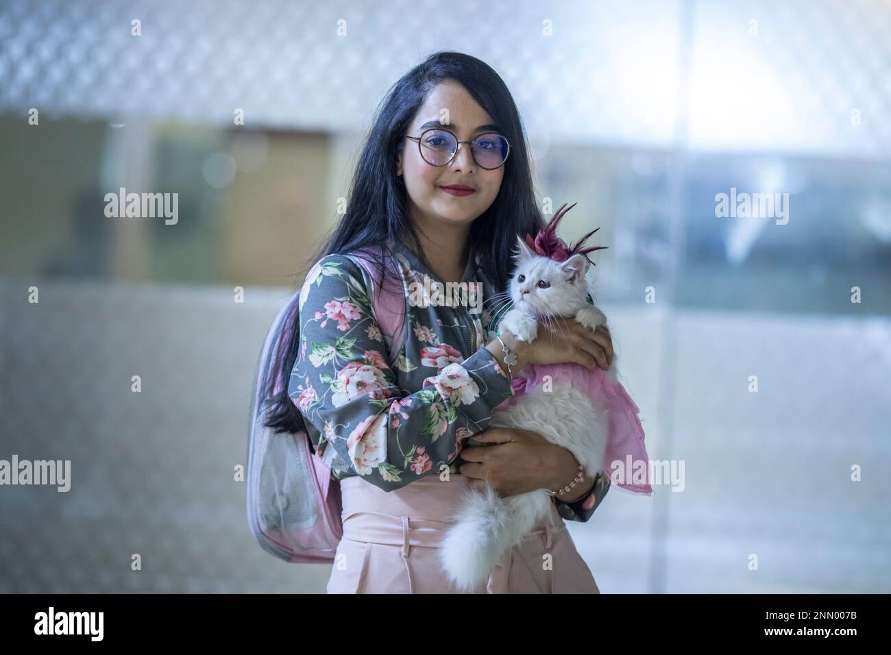 Dhaka, Bangladesh. 24th Feb, 2023. A cat owner shows off her pet cat ...
