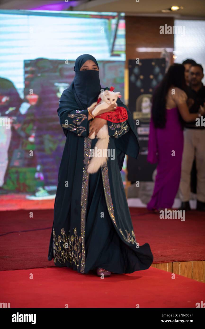 Dhaka, Bangladesh. 24th Feb, 2023. A cat owner shows off her pet cat ...