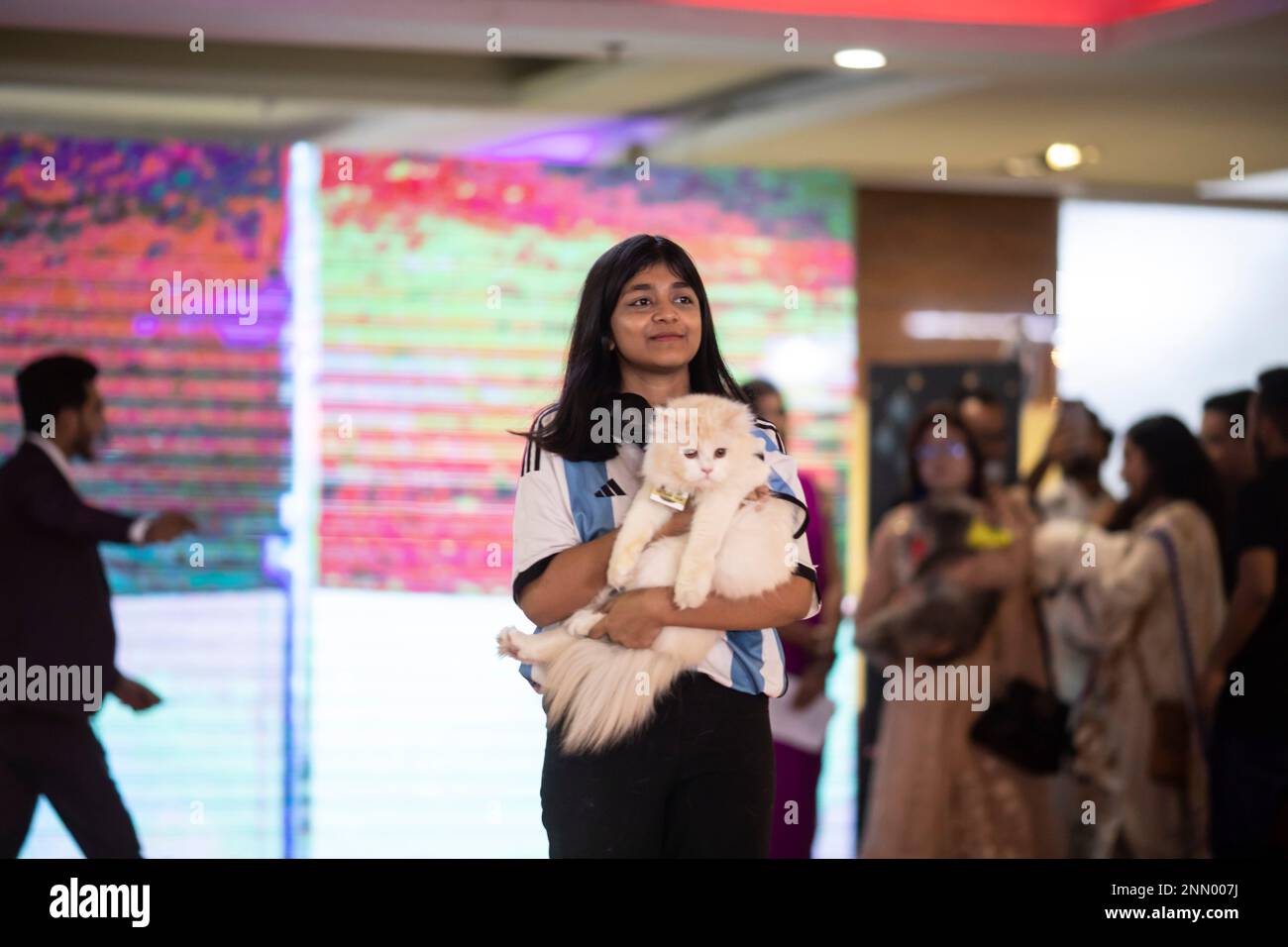 Dhaka, Bangladesh. 24th Feb, 2023. A cat owner shows off her pet cat ...