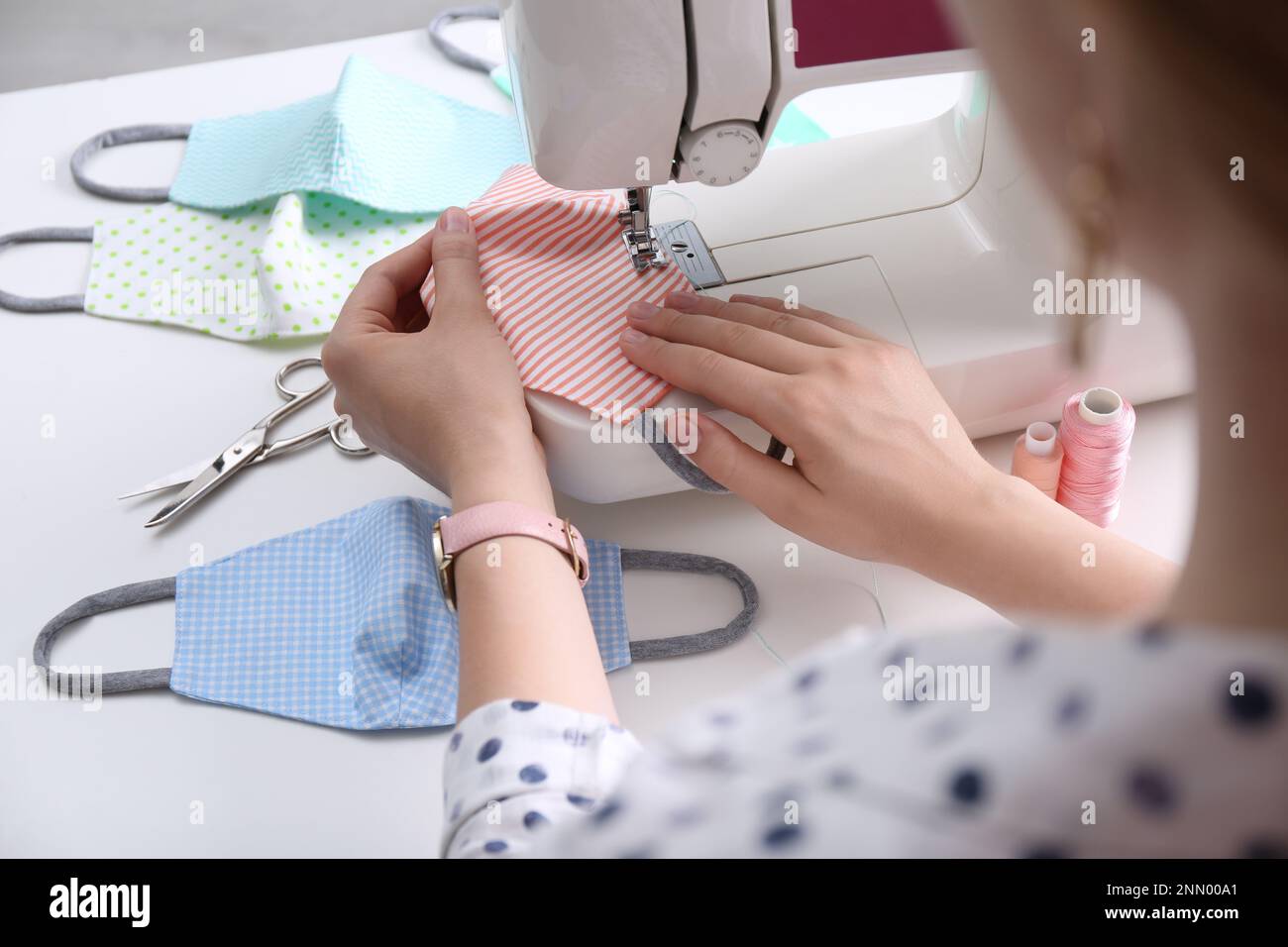 Female tailor making face mask hi-res stock photography and images - Alamy