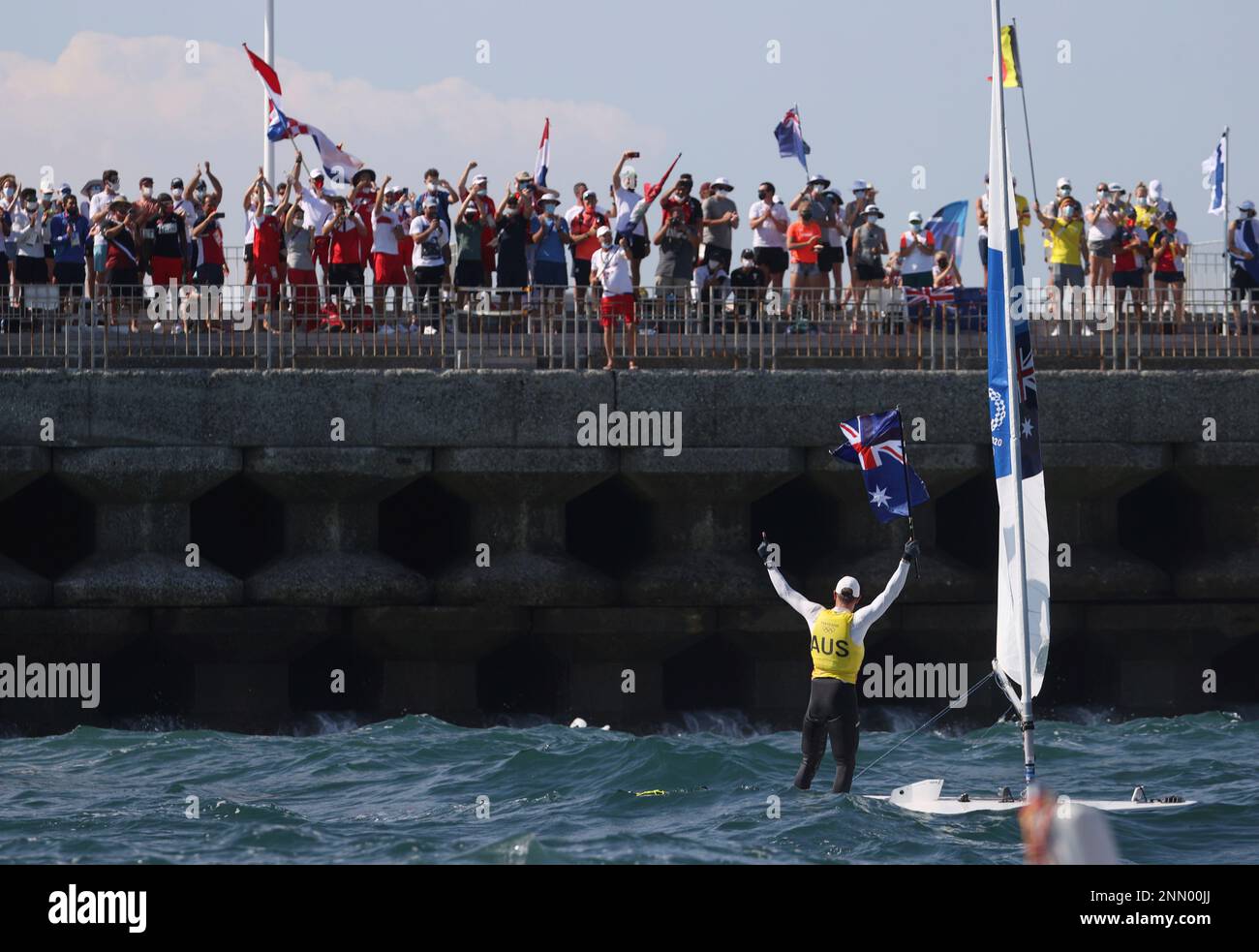 Australian WEARN Matt waves a flag after winning Sailing Men's One ...