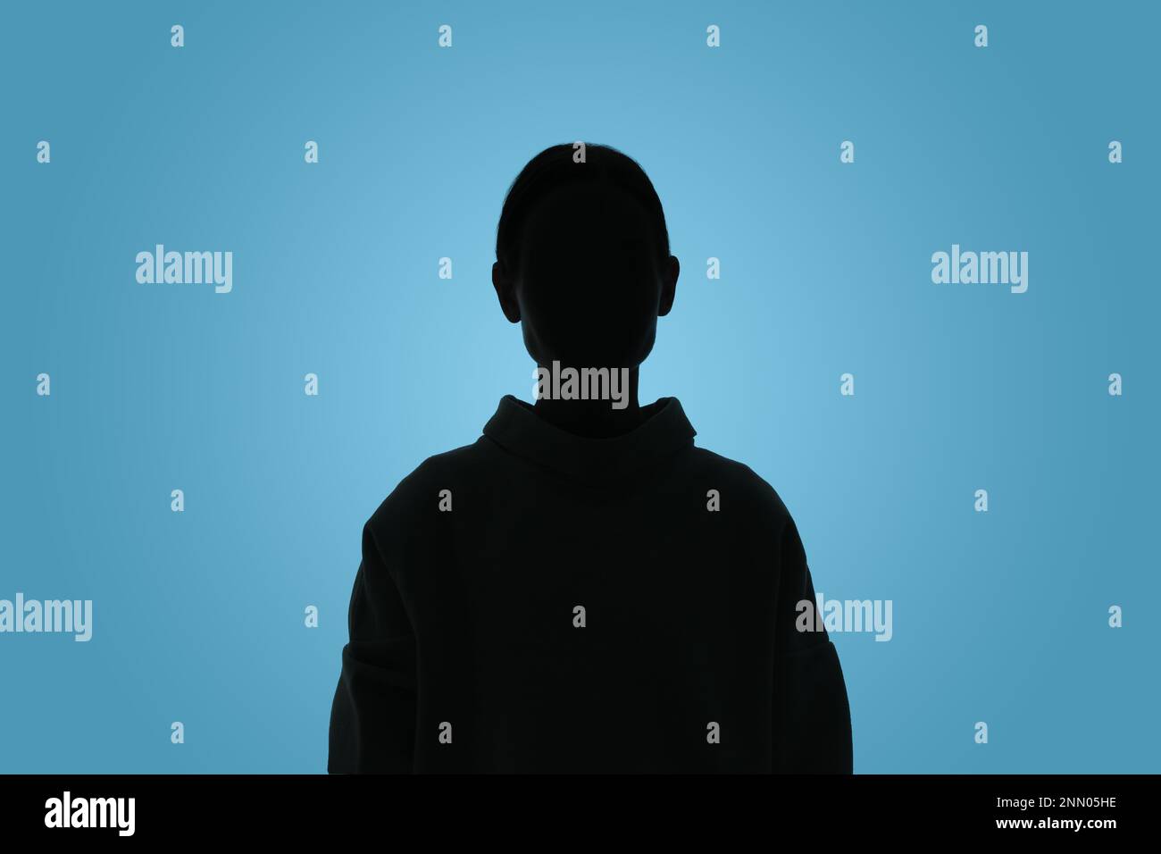 Silhouette of anonymous woman on light blue background Stock Photo - Alamy