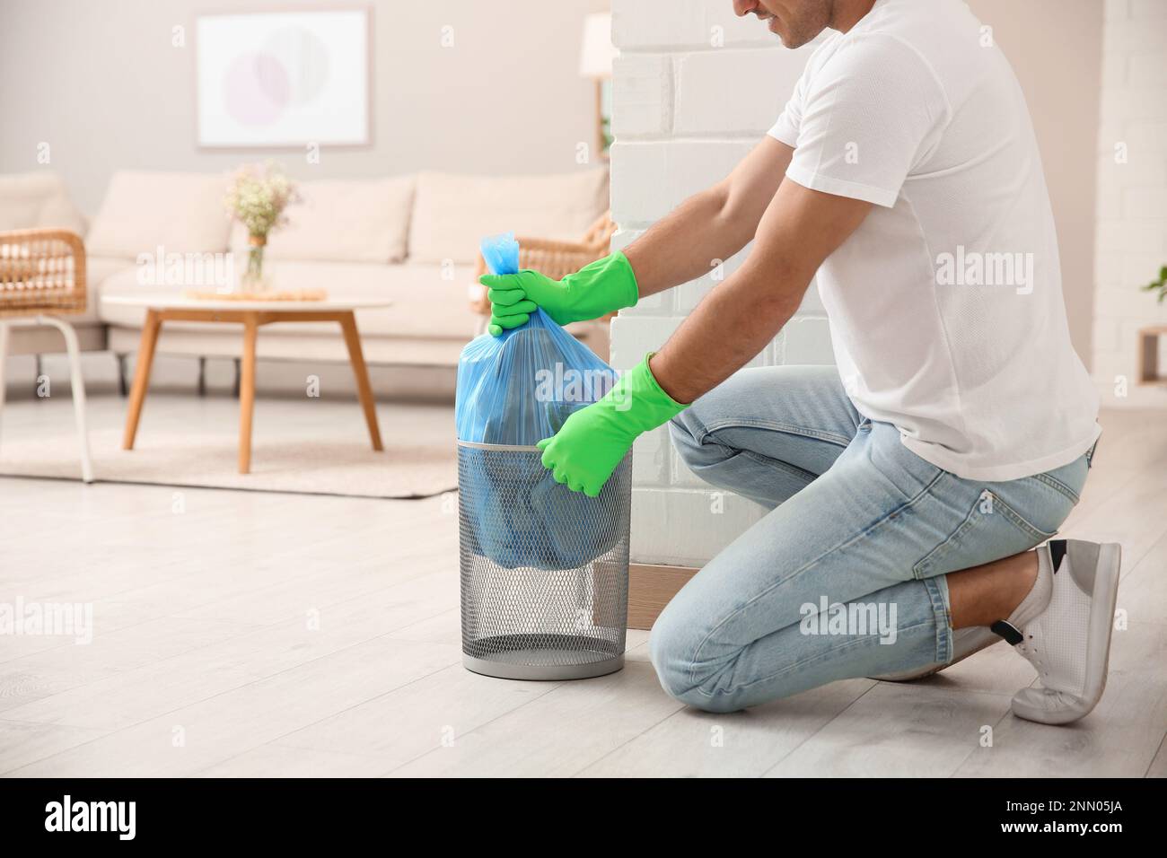 Man taking garbage bag out of bin at home, closeup Stock Photo - Alamy