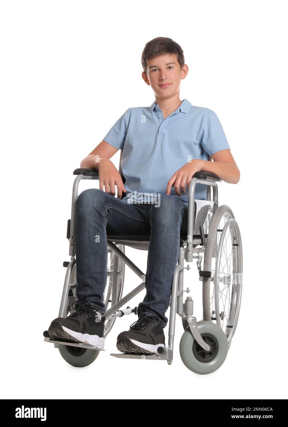 Teenage boy in wheelchair on white background Stock Photo - Alamy
