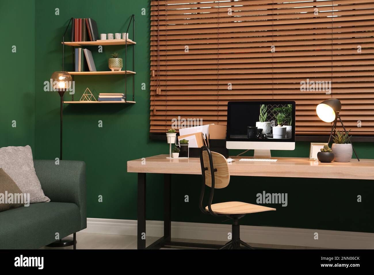 Comfortable workplace with modern computer near window in room ...