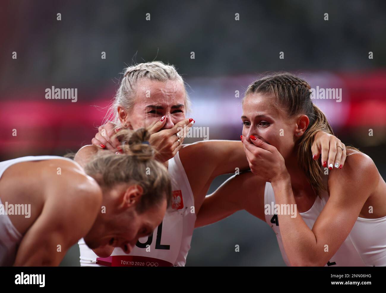 Poland's team members celebrate after winning the 4 x 400m Relay Mixed ...