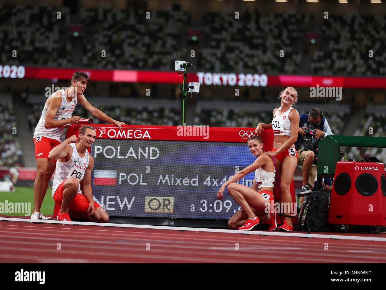 Poland's team members pose for photo after winning 4 x 400m Relay Mixed ...