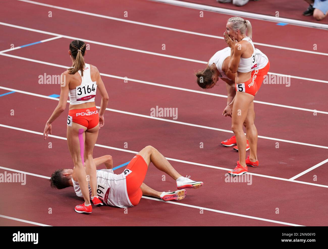 Poland's team members celebrate after winning the 4 x 400m Relay Mixed ...
