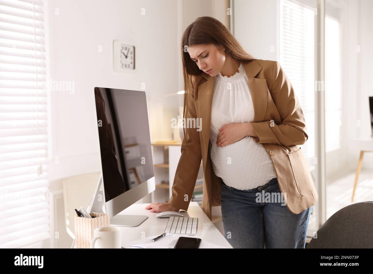 Pregnant at work with tea hi-res stock photography and images - Alamy