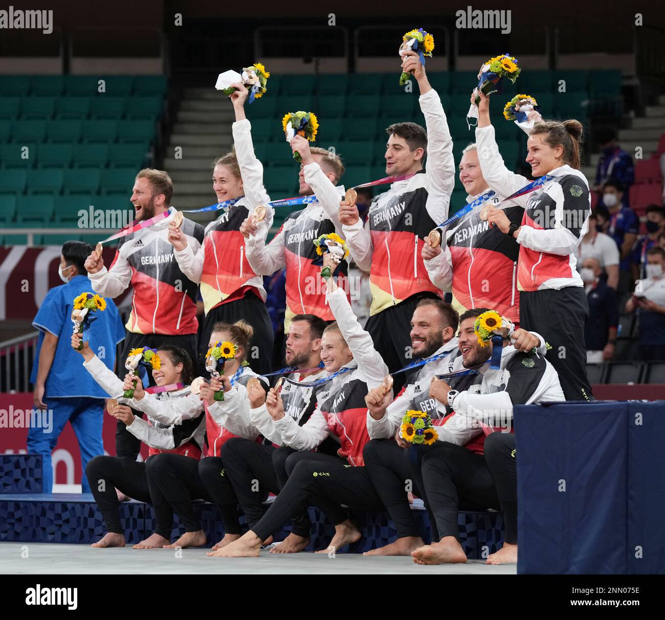 Members of Germany celebrate during an award ceremony of Judo mixed ...
