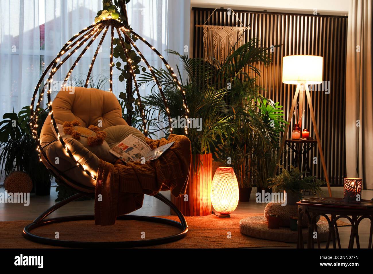 Indoor terrace interior with comfortable hanging chair and houseplants ...