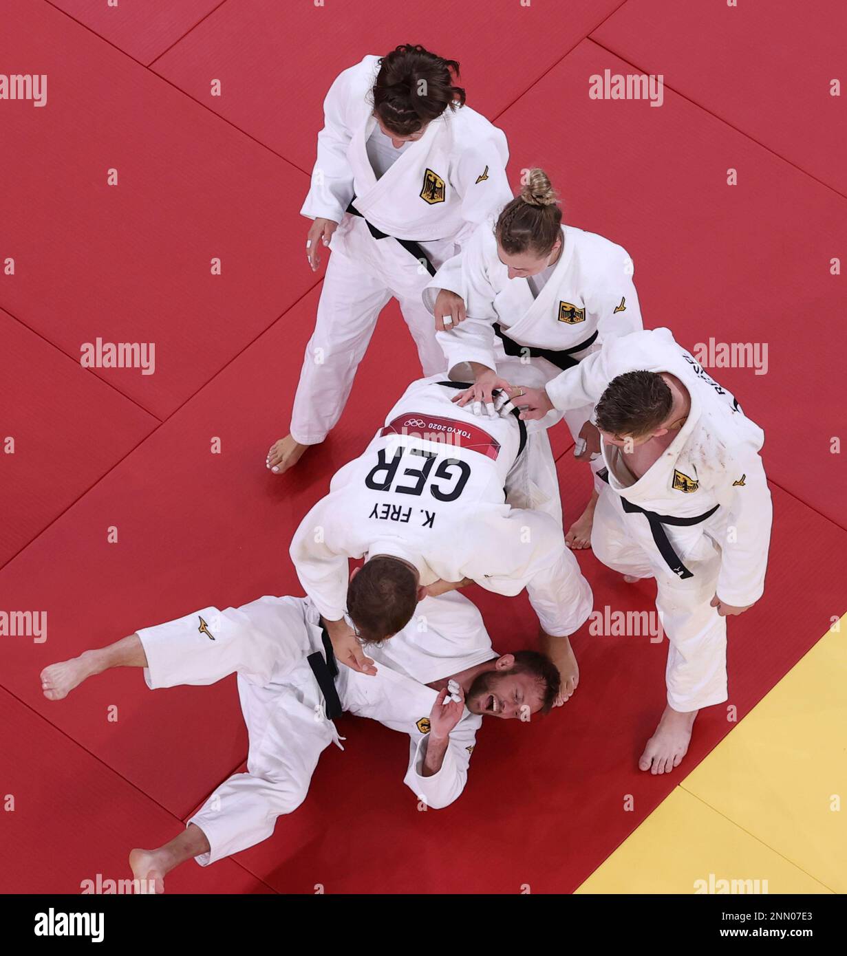 Members of Germany celebrate after winning Judo mixed team bronze medal ...